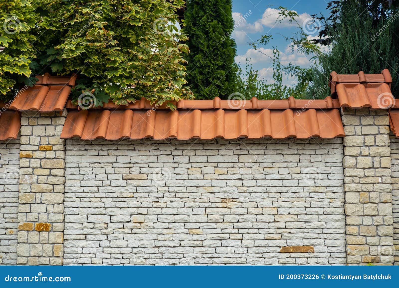 Modern Brick Pattern of Light Stone Fence Wall with Tiles in Front of a ...