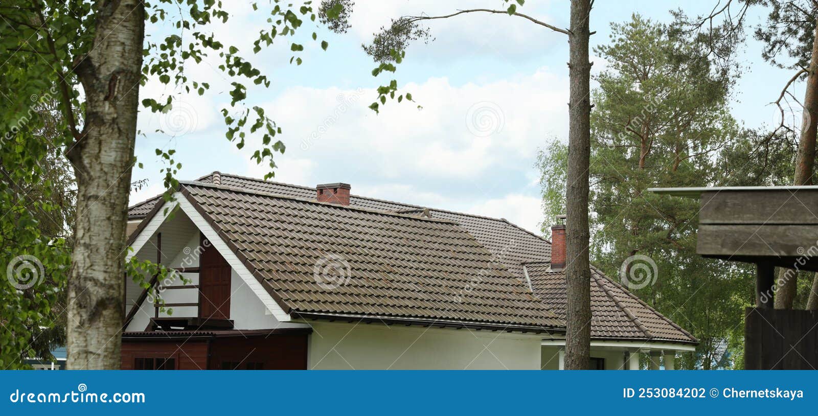 Modern Building with Brown Roof Outdoors on Spring Day Stock Photo ...