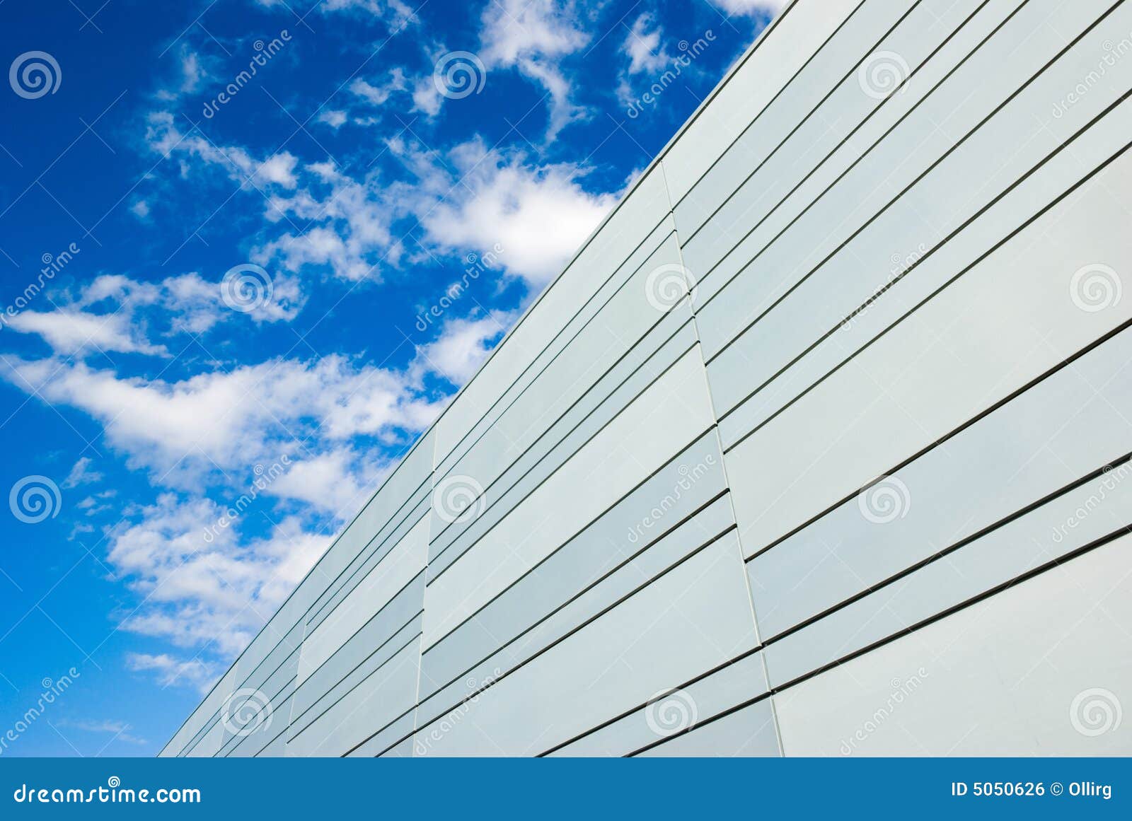 Modern building and clouds stock photo. Image of geometric - 5050626