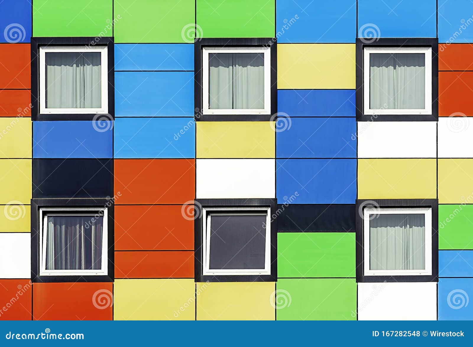 Modern Building with Colorful Walls and Square Windows Under Sunlight ...