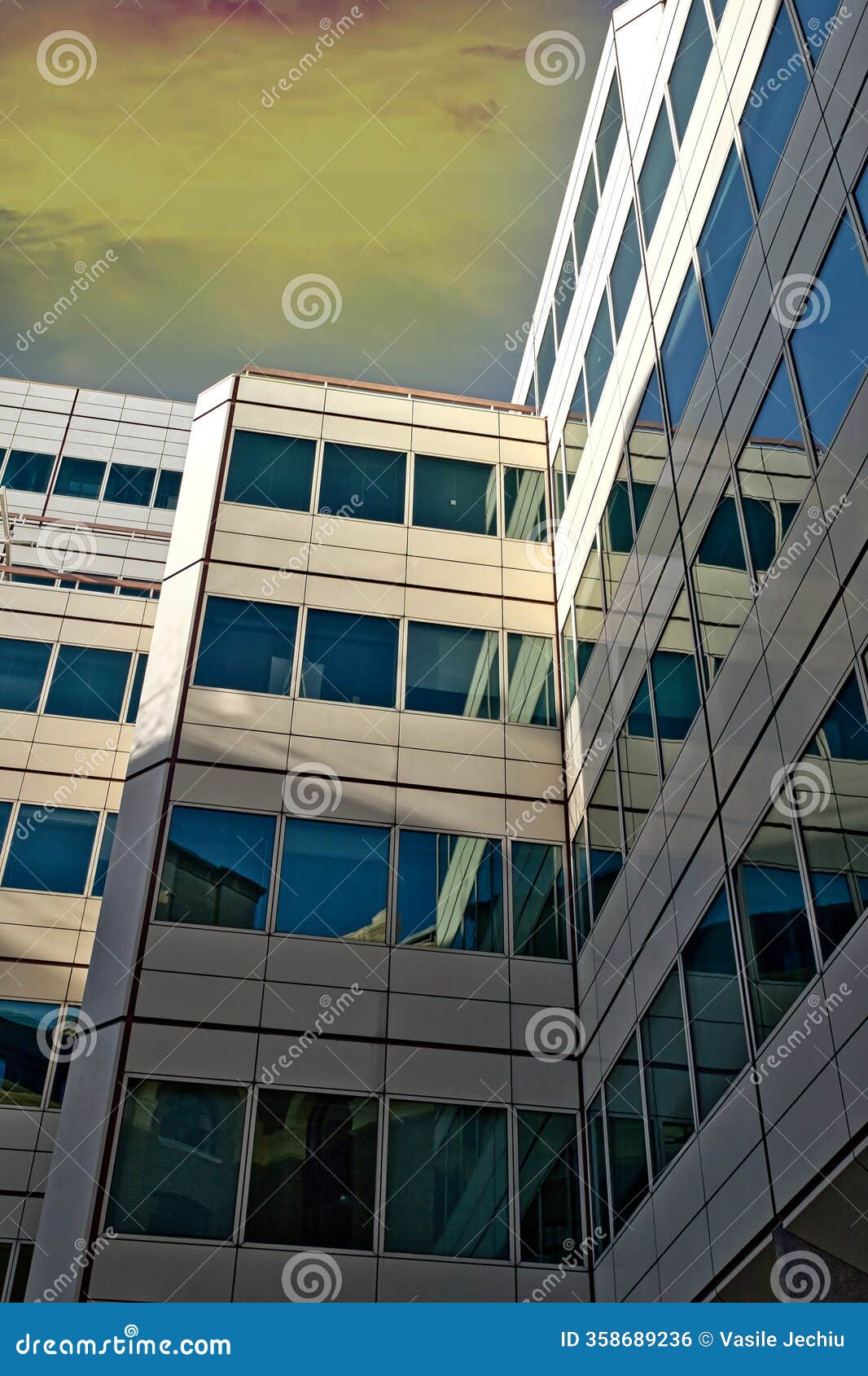 Modern Building Facade with Off-White and Reflective Glass Panels in ...