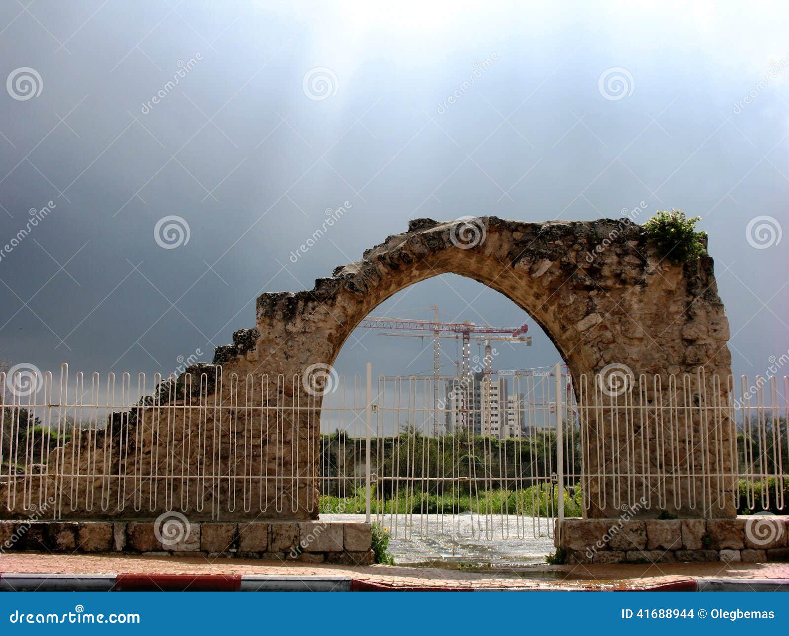 Modern Building in the Frame of Ancient Stone Arches Stock Photo ...