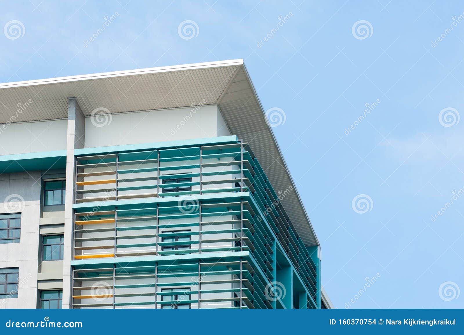 Modern Building with Green and Yellow Panel Stock Photo - Image of gray ...