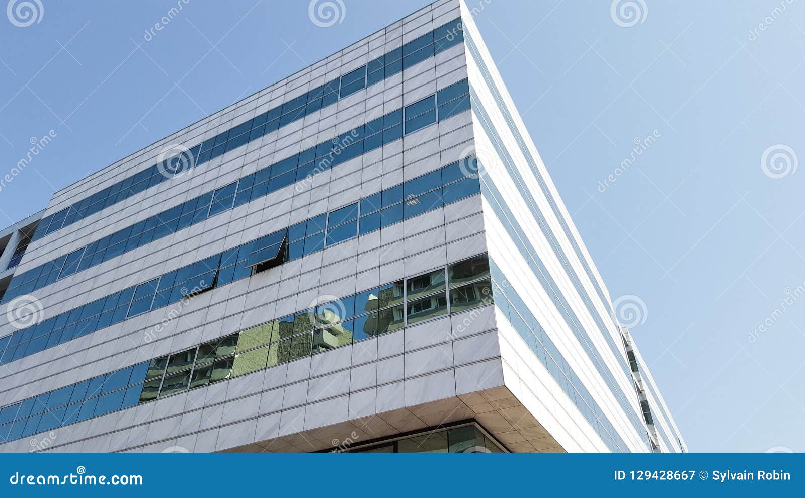 Modern Building in Light Blue Sky Stock Image - Image of tower, glass ...