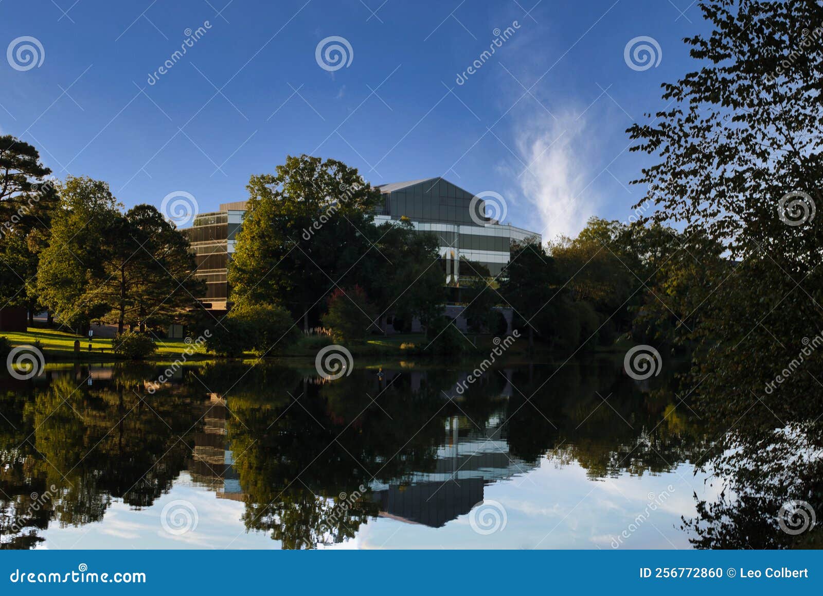 Modern Building Surrounded by Trees with Great Reflection Off Lake ...