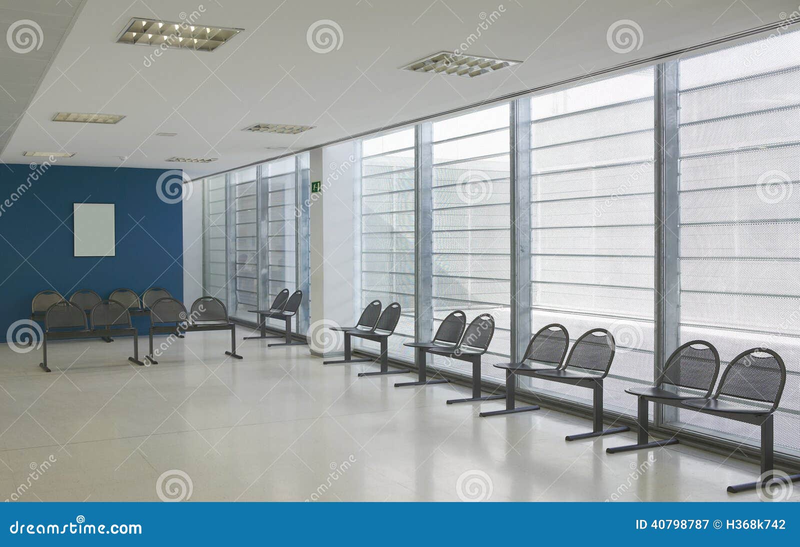 Modern Building Waiting Area with Metallic Chairs Stock Image - Image ...