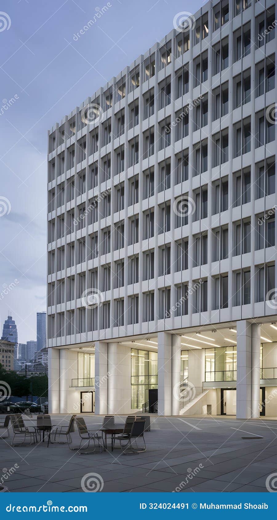Modern Building with White Facade and Grid Pattern Overlooks City ...
