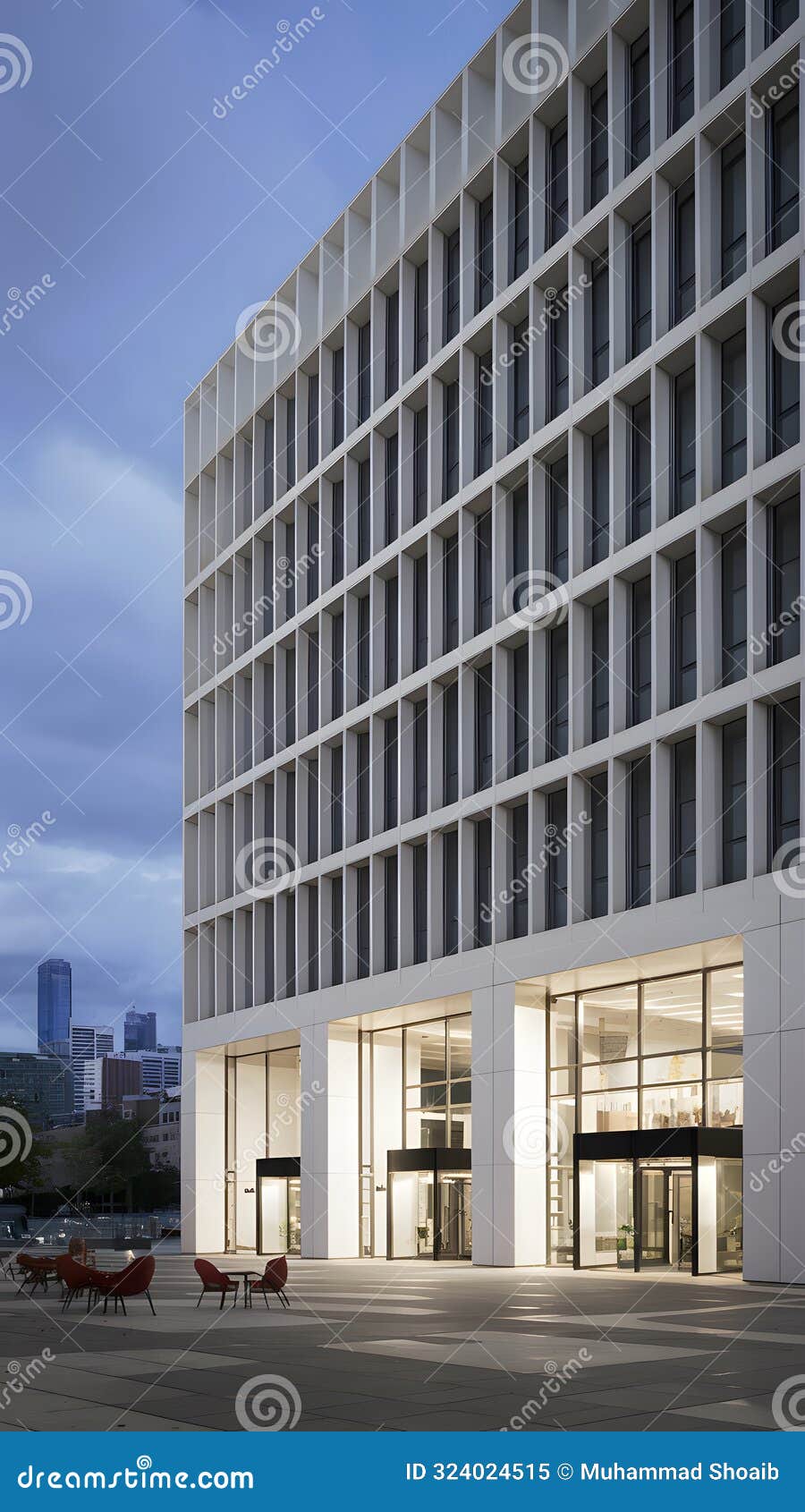 Modern Building with White Facade and Grid Pattern Overlooks City ...