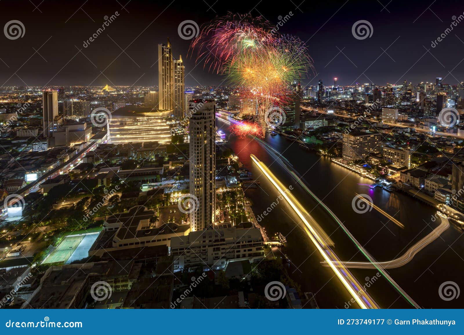 Modern Buildings in the City with Water Reflection, Firework, Light ...