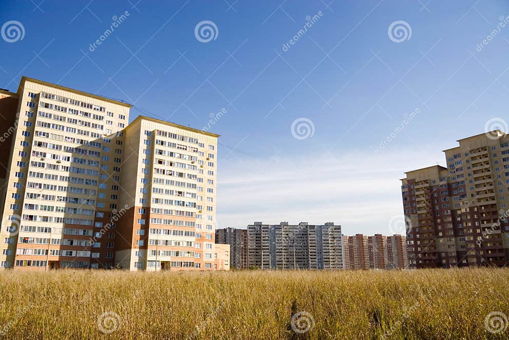 Modern Buildings in a Field Stock Image - Image of house, contrasts ...