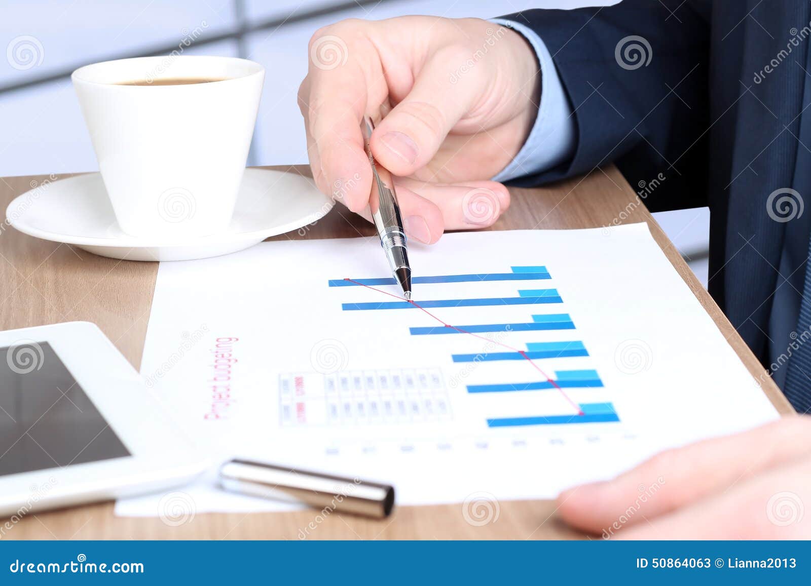 Modern Business Man Doing Business, Graphs and Charts Behind Stock ...