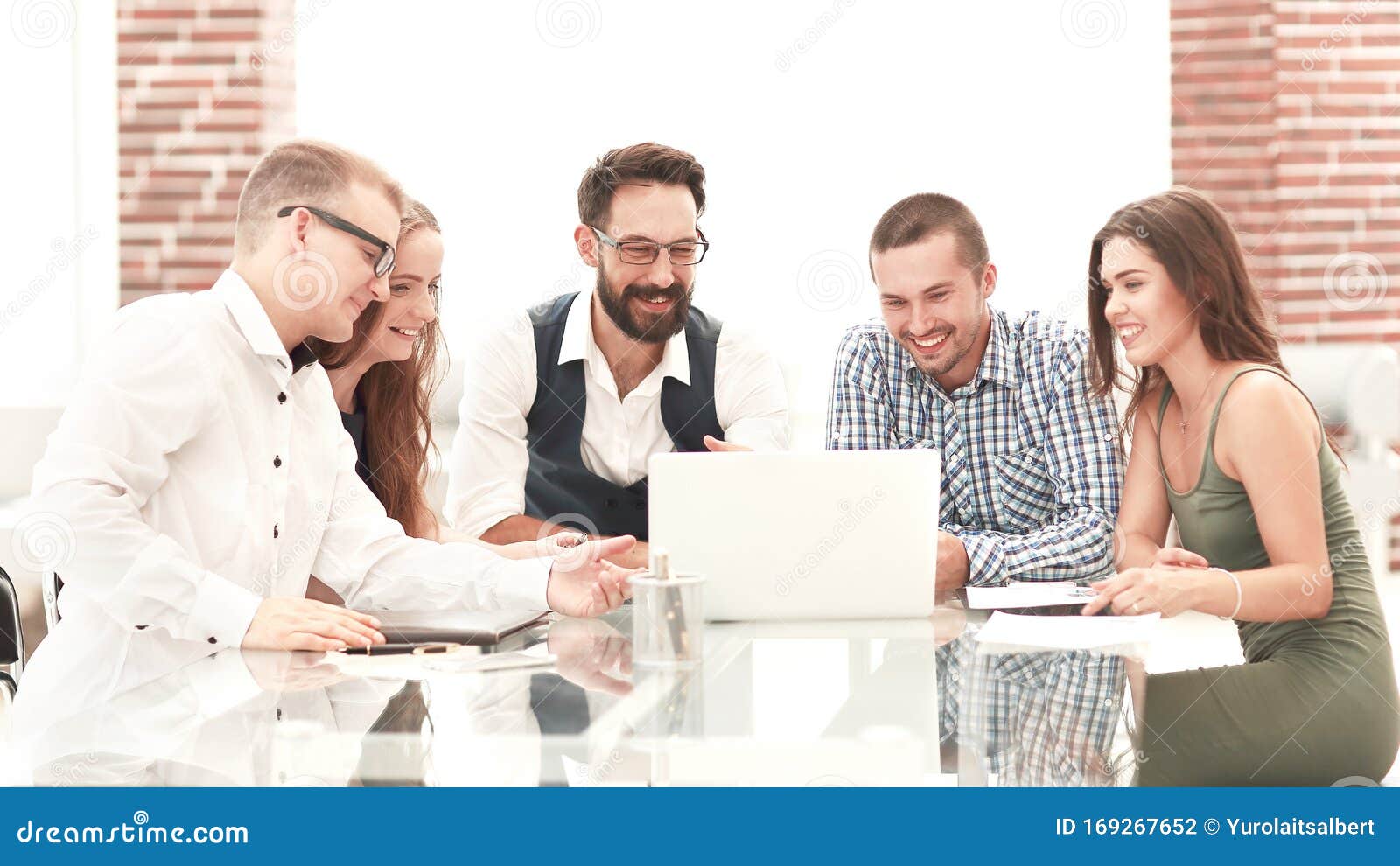 Modern Business Team Using a Laptop in the Workplace Stock Photo ...