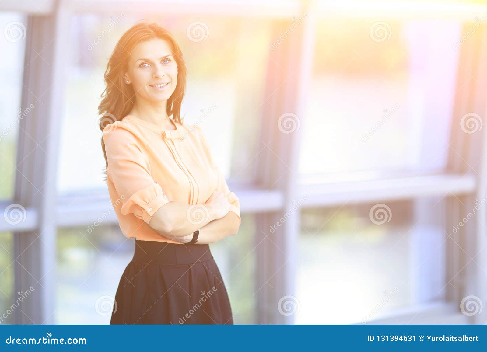 Modern Business Woman Standing Near A Large Window In The Office Stock