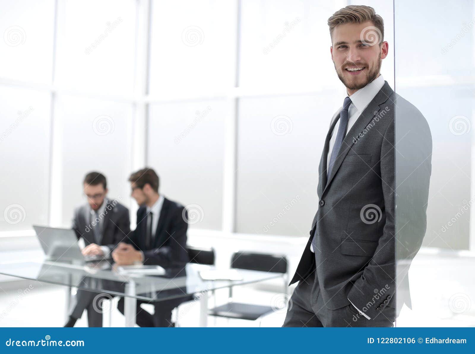 Modern Businessman on the Background of the Office Stock Photo - Image ... Modern Businessman on the Background of the Office Stock Photo - Image ...