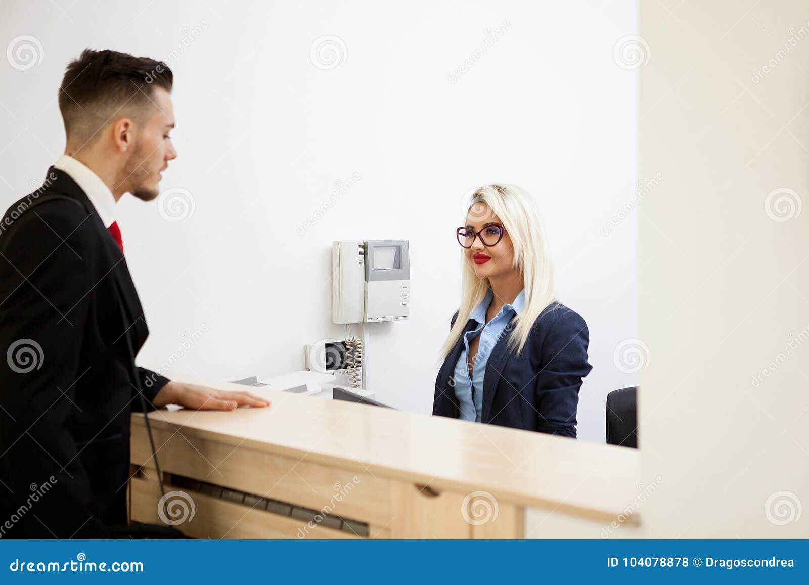 Businessman in Office Reception Area Talking with Secretary Stock Photo ...