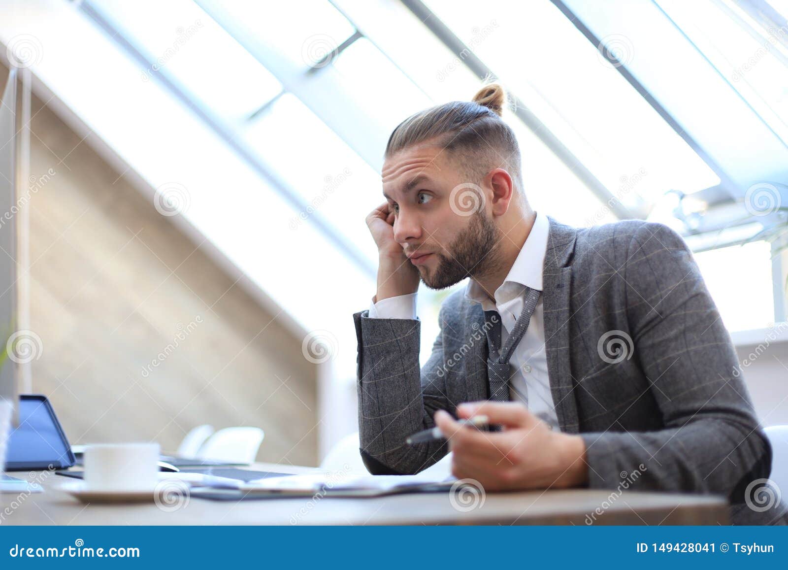 Modern Businessman Thinking about Something while Sitting in the Office ...