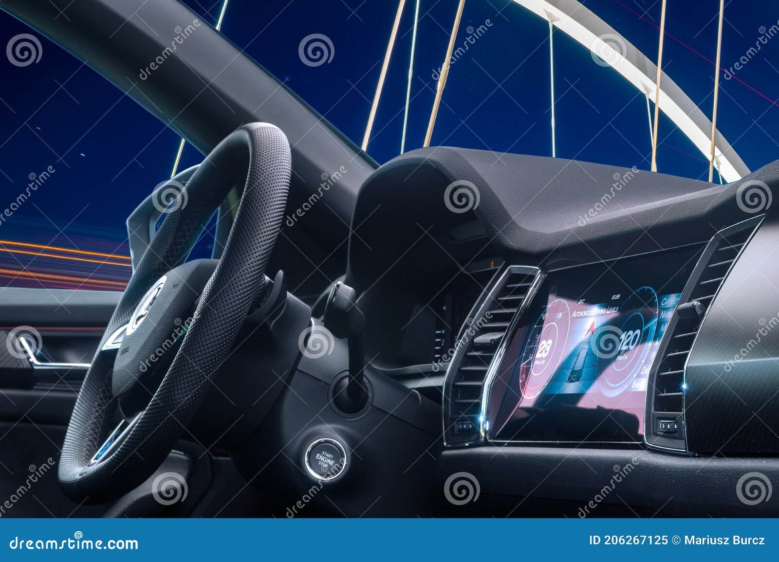 A Modern Car Cockpit Against the Background of an Illuminated Bridge ...