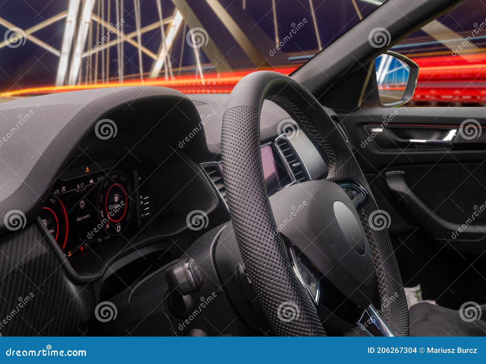 A Modern Car Cockpit Against the Background of an Illuminated Bridge ...