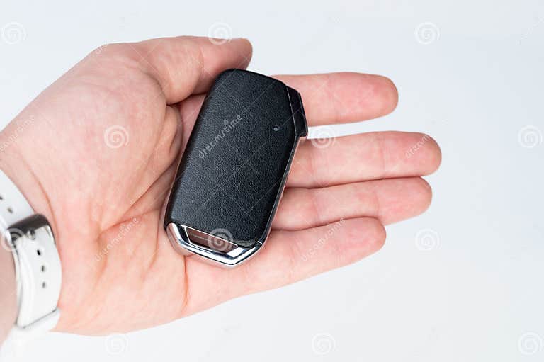 Modern car key in hand stock photo. Image of lease, open - 295830160