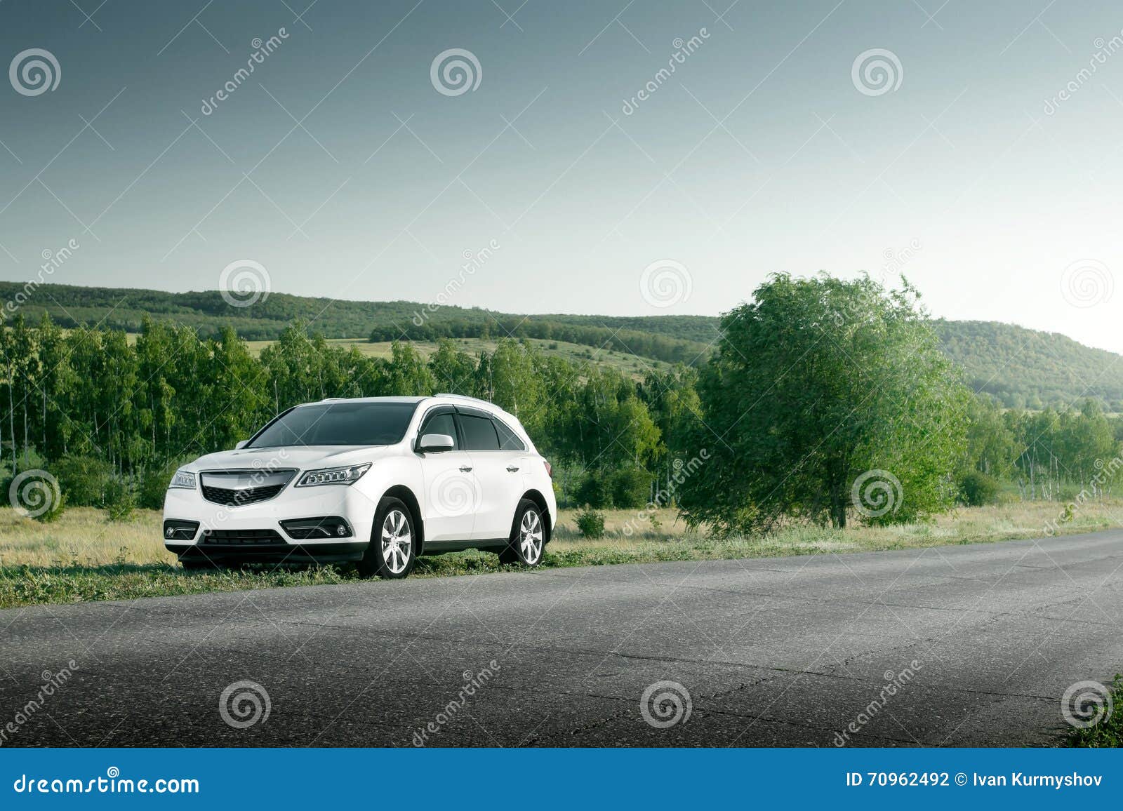 Modern Car Standing on Road at Sunset Stock Photo - Image of green ...