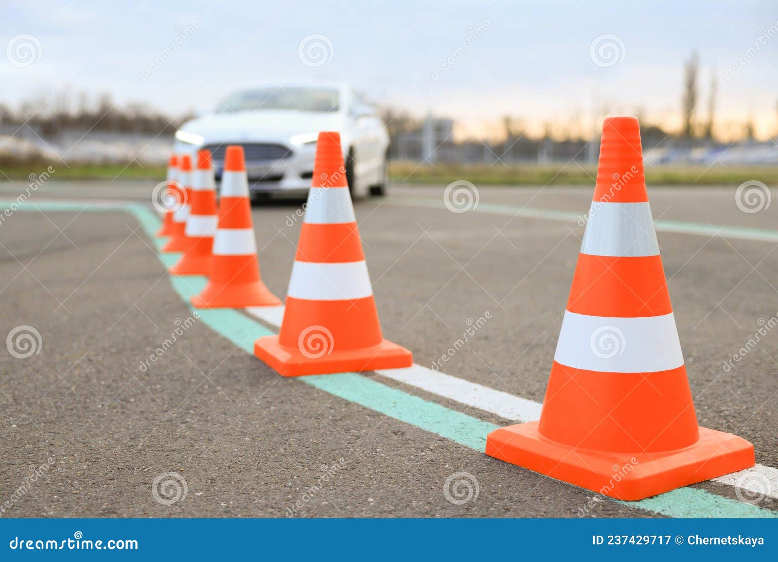 Modern Car at Test Track, Focus on Traffic Cone. Driving School Stock ...
