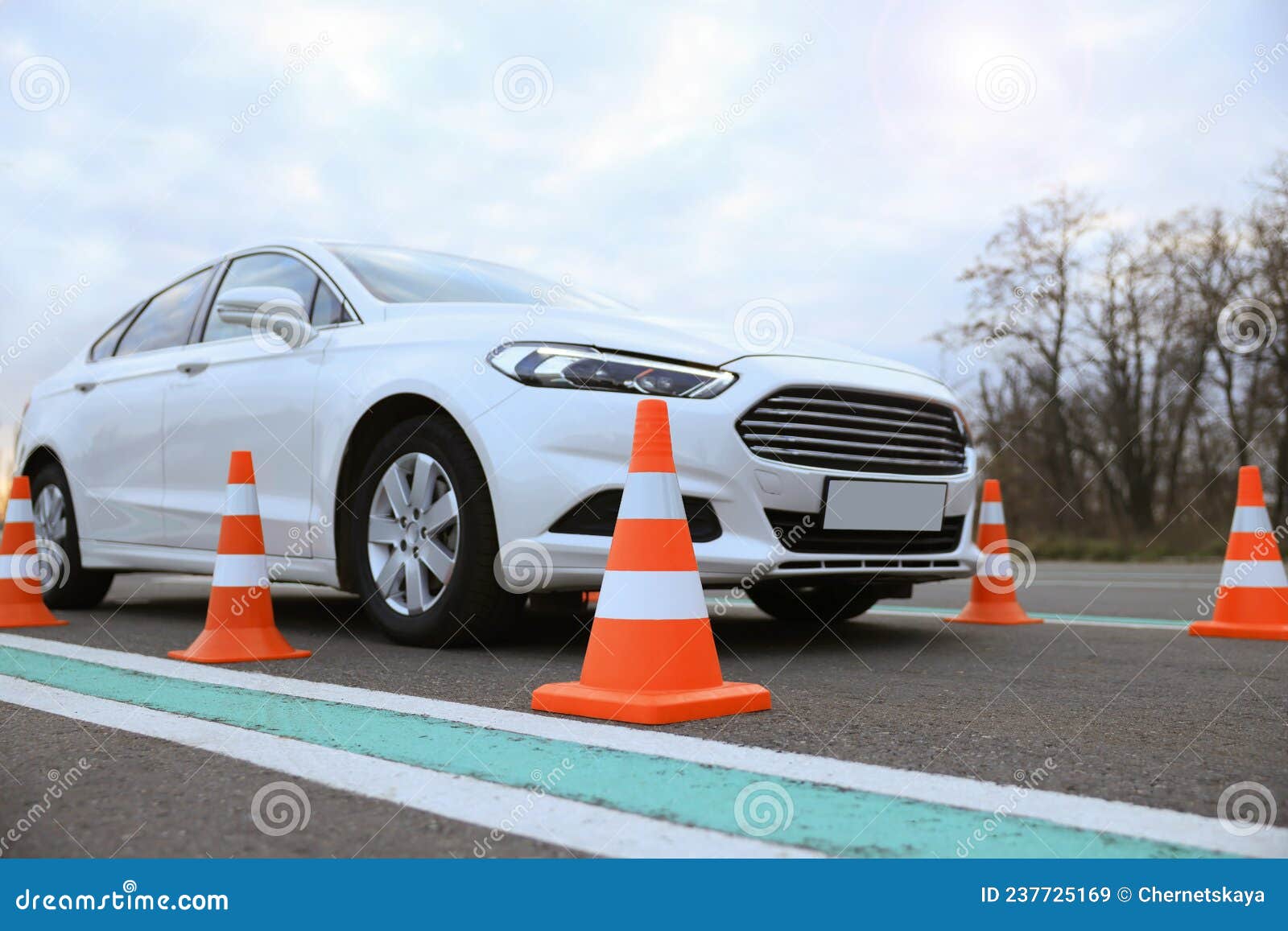 Modern Car on Test Track with Traffic Cones, Low Angle View. Driving ...