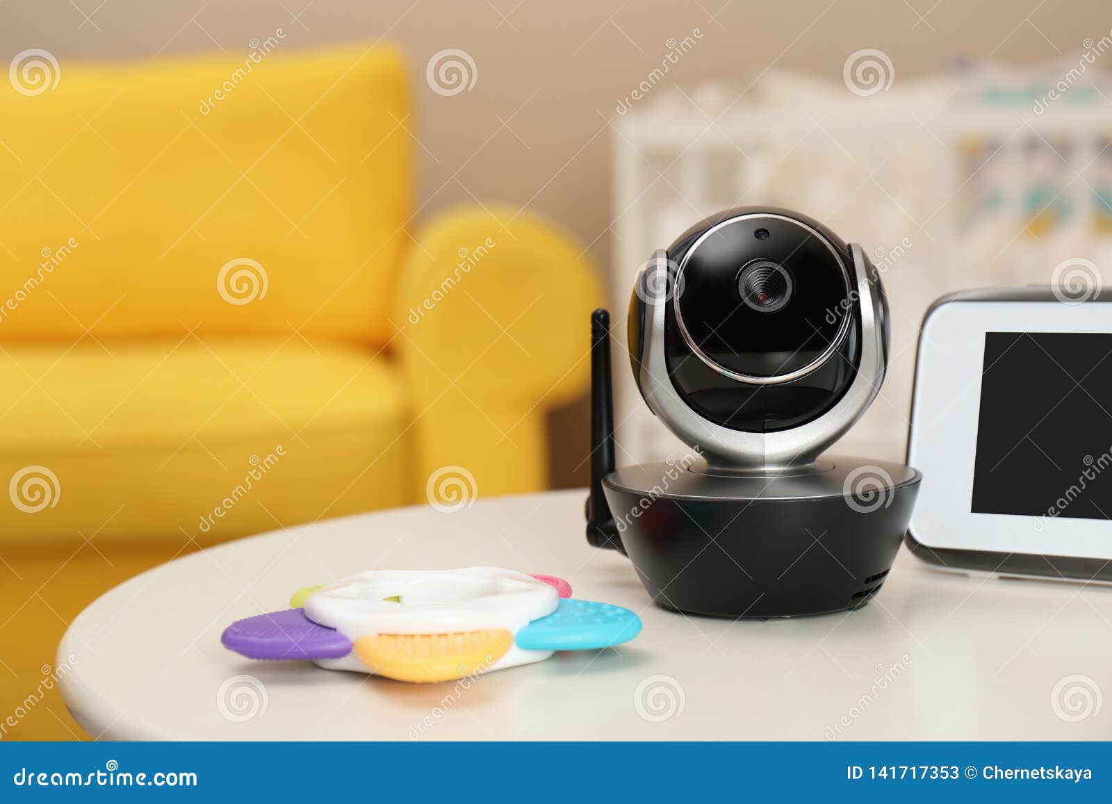 Modern CCTV Security Camera, Monitor and Teether on Table in Nursery ...