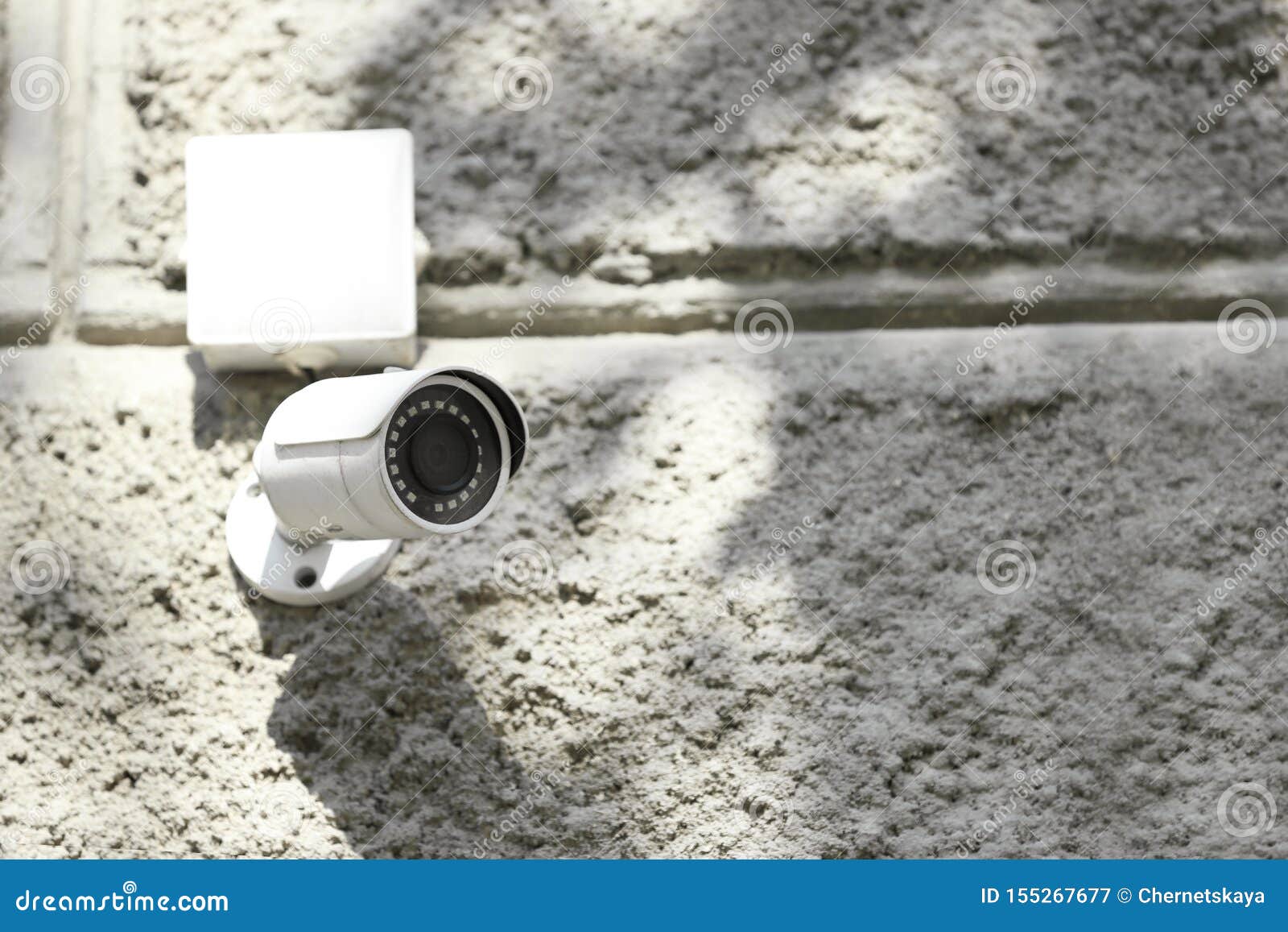 Modern CCTV Security Camera on Stone Wall Outdoors. Space for Text ...