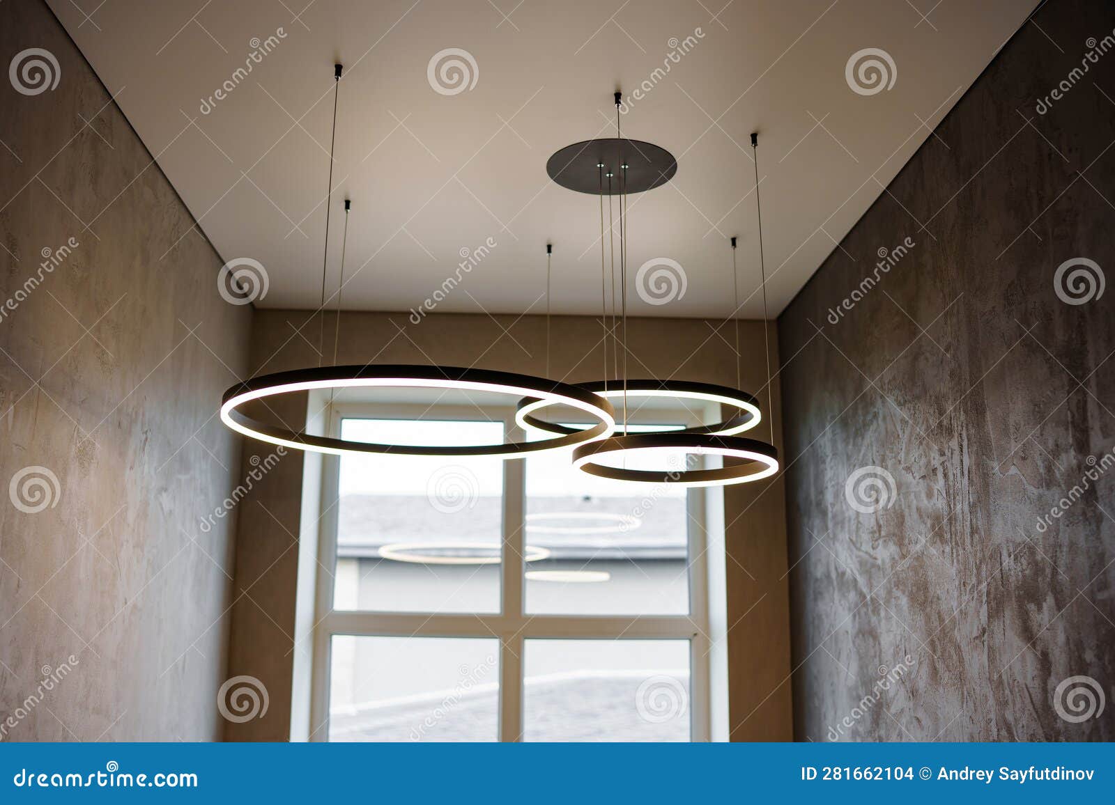 Modern Ceiling Lamp of Three Rings in the Interior. Stock Photo - Image ...