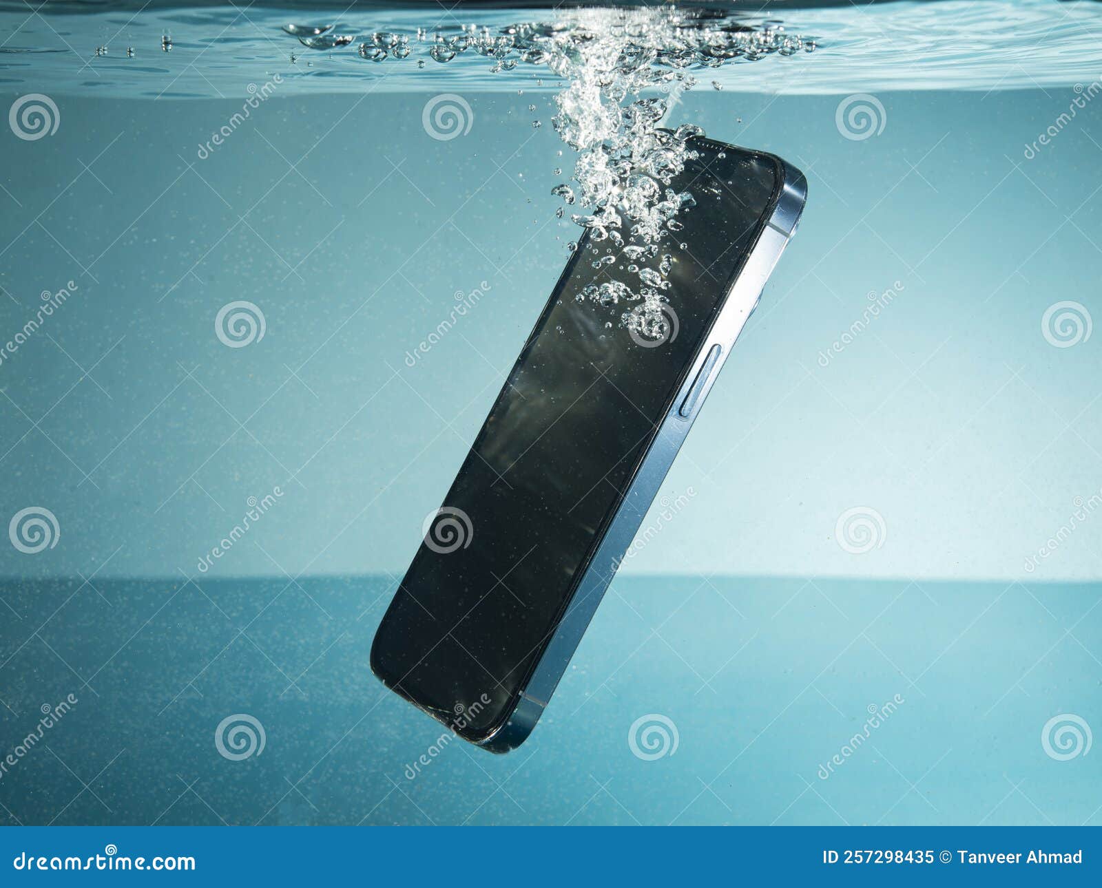 Modern Cell Phone Drowning into Tank of Water - Risk Concept Stock ...
