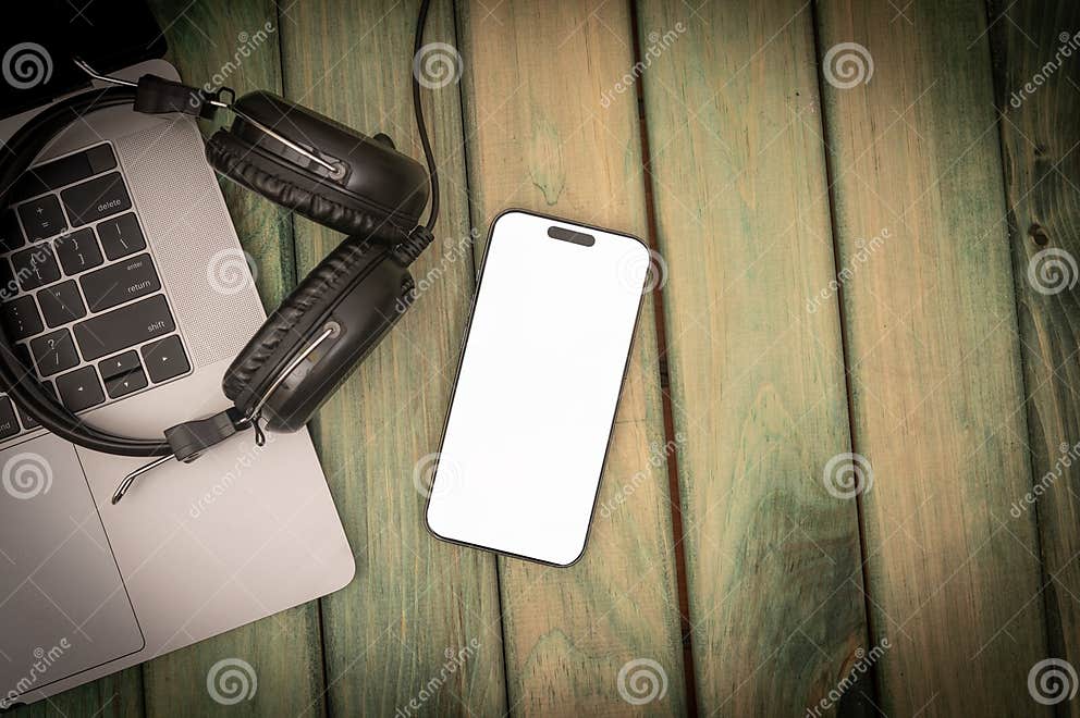 Modern Cell Phone on Table with Laptop and Headphone Stock Image ...
