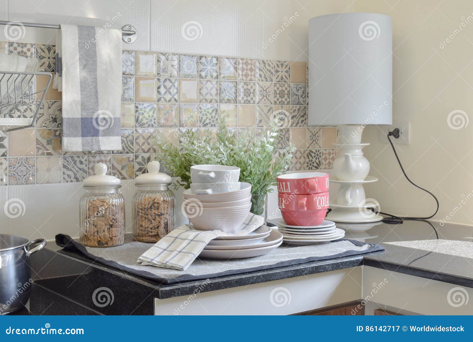 Modern Ceramic Kitchenware and Utensils on the Black Counter Top Stock ...