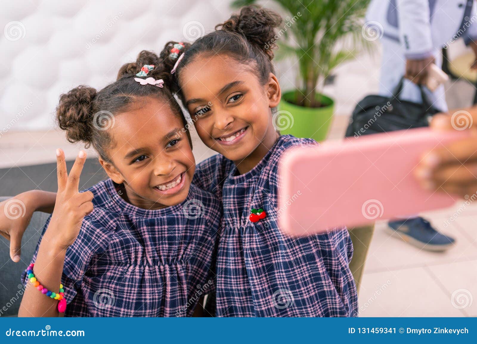 Modern Beaming Children Making Selfie while Sitting in Cafeteria Stock ...