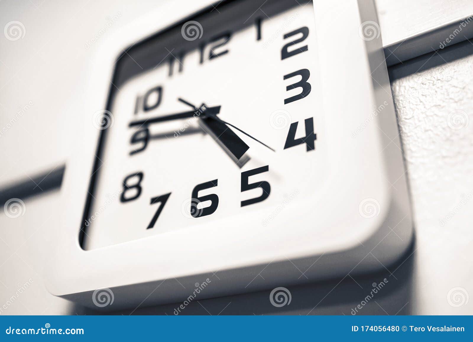 Modern Clock on a Wall. almost 5 O`clock in the Afternoon or Morning ...