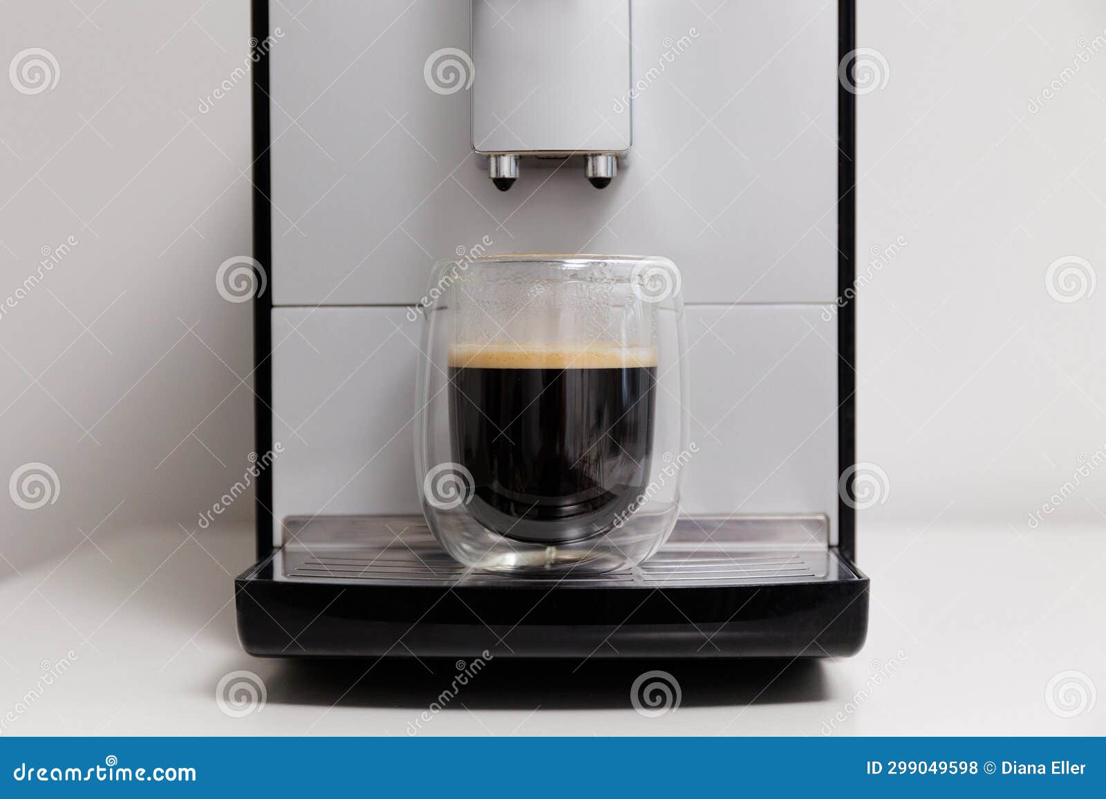 Modern Coffee Machine with Glass Cup of Espresso on the Table at the ...