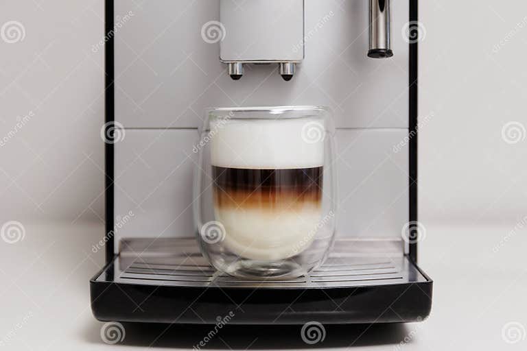 Modern Coffee Machine with Glass Cup of Latte on the Table Stock Image ...