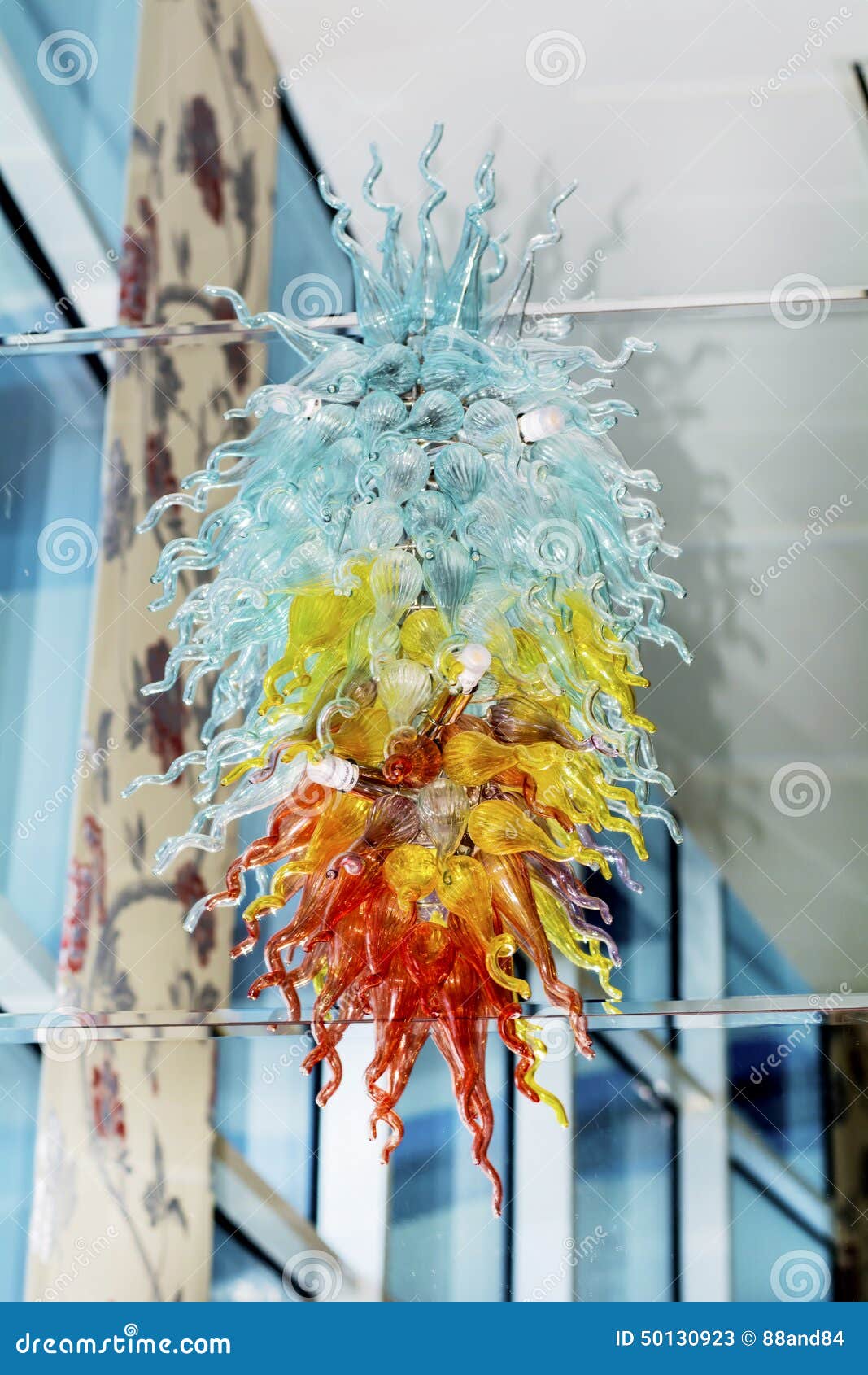 Modern Colorful Glass Chandelier on a White Wall Stock Image - Image of ...