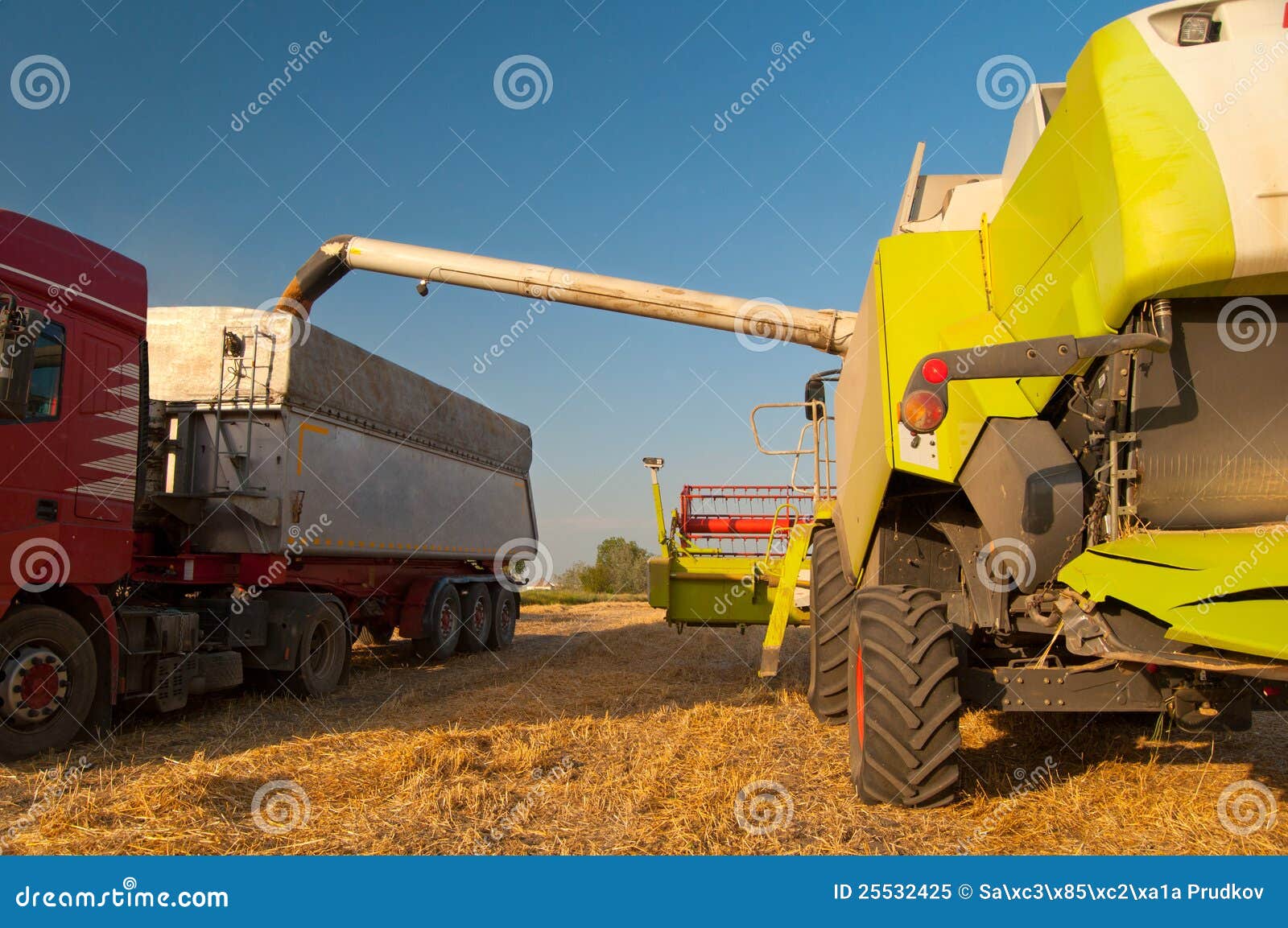 Modern Combine Harvester Unloading Grain in Truck Stock Image - Image ...