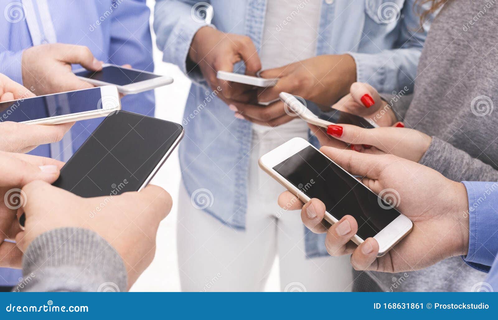 Group of Millennials Using Cellphones, Standing in Circle Stock Image ...