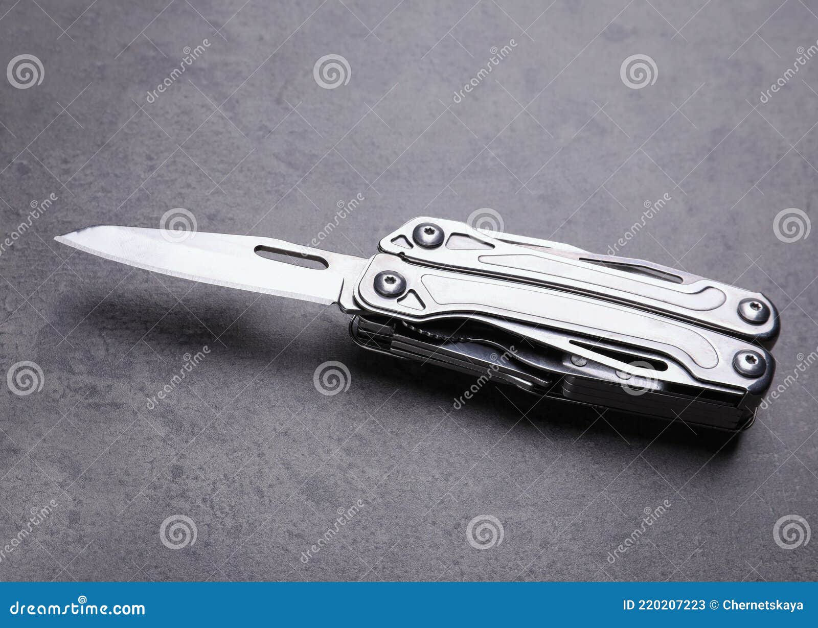 Modern Compact Portable Multitool on Grey Table Stock Image - Image of ...