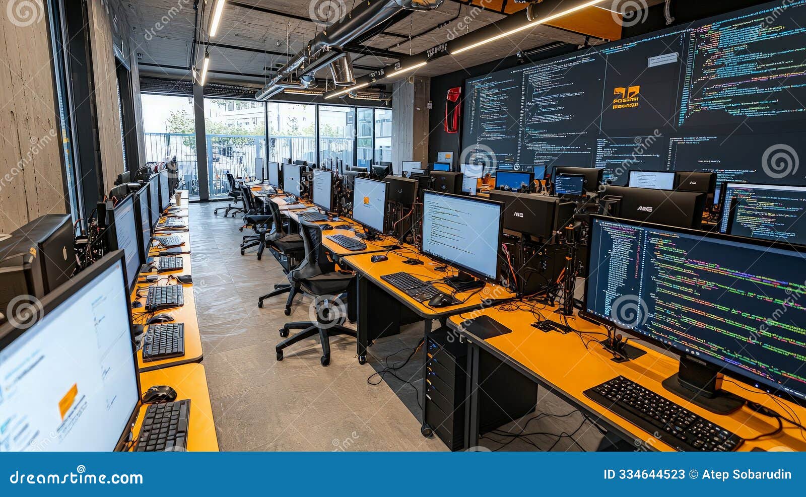 Modern Computer Lab with Yellow Desks and Code on the Wall Stock Image ...