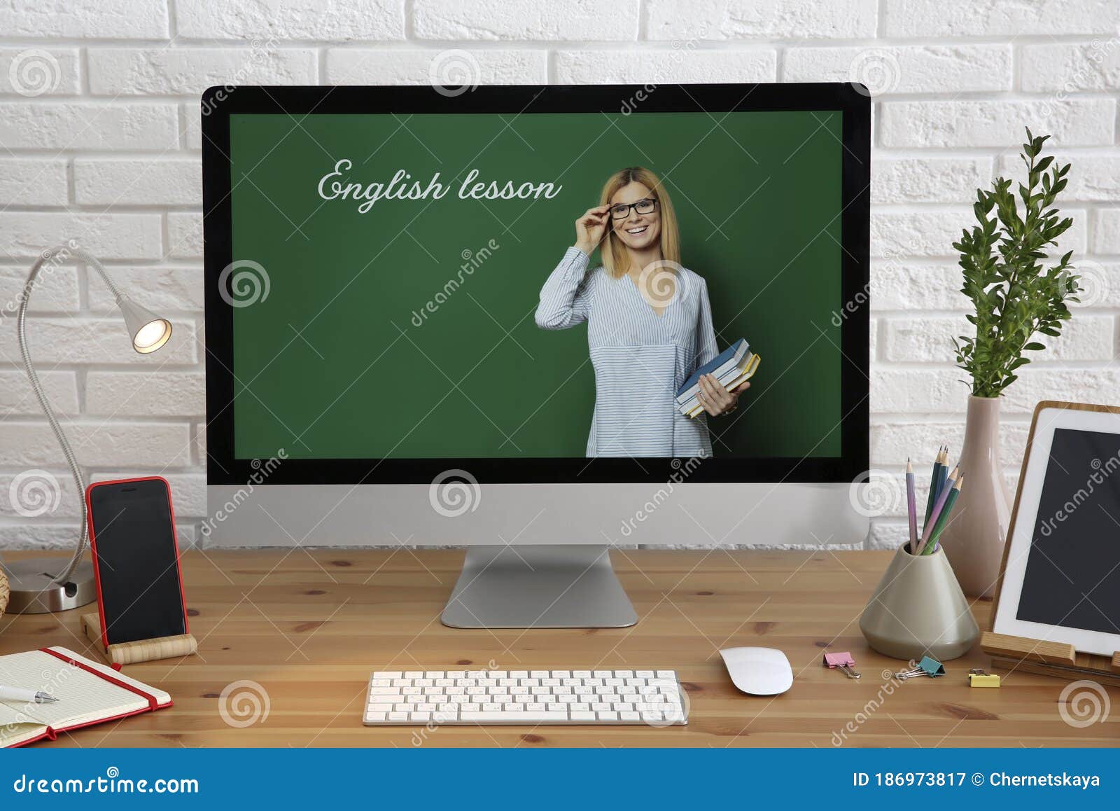 Computer for Online English Learning with Teacher on Table Indoors ...