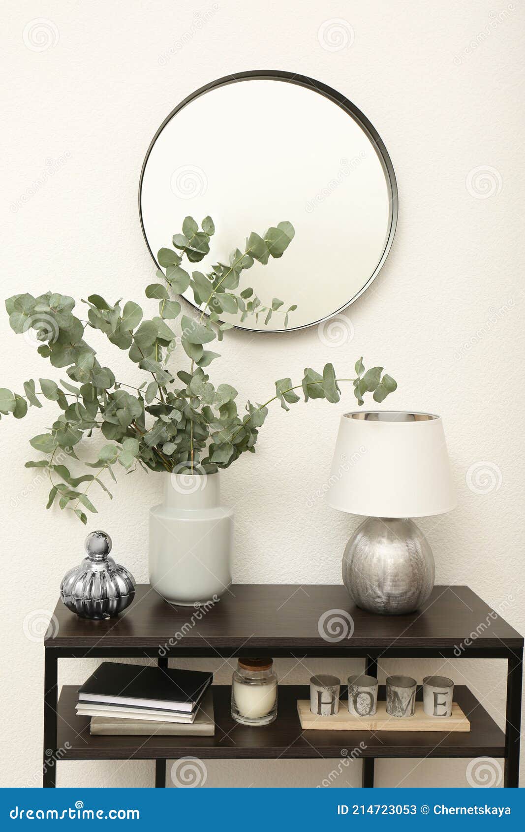 Modern Console Table with Stylish Decor and Mirror on White Wall in ...