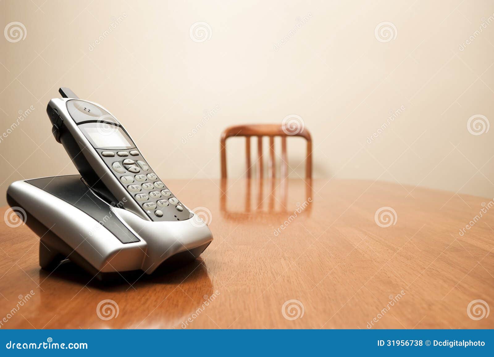 Modern Cordless Phone Sitting on an Empty Table Stock Photo - Image of ...