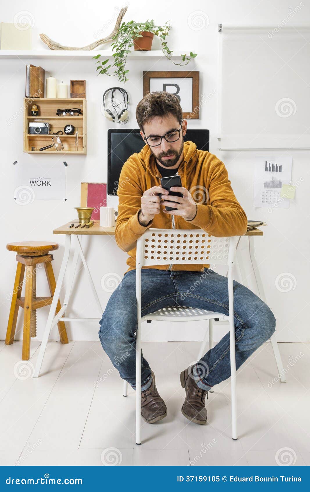 Modern Creative Man with Smartphone on Workspace. Stock Image - Image ...