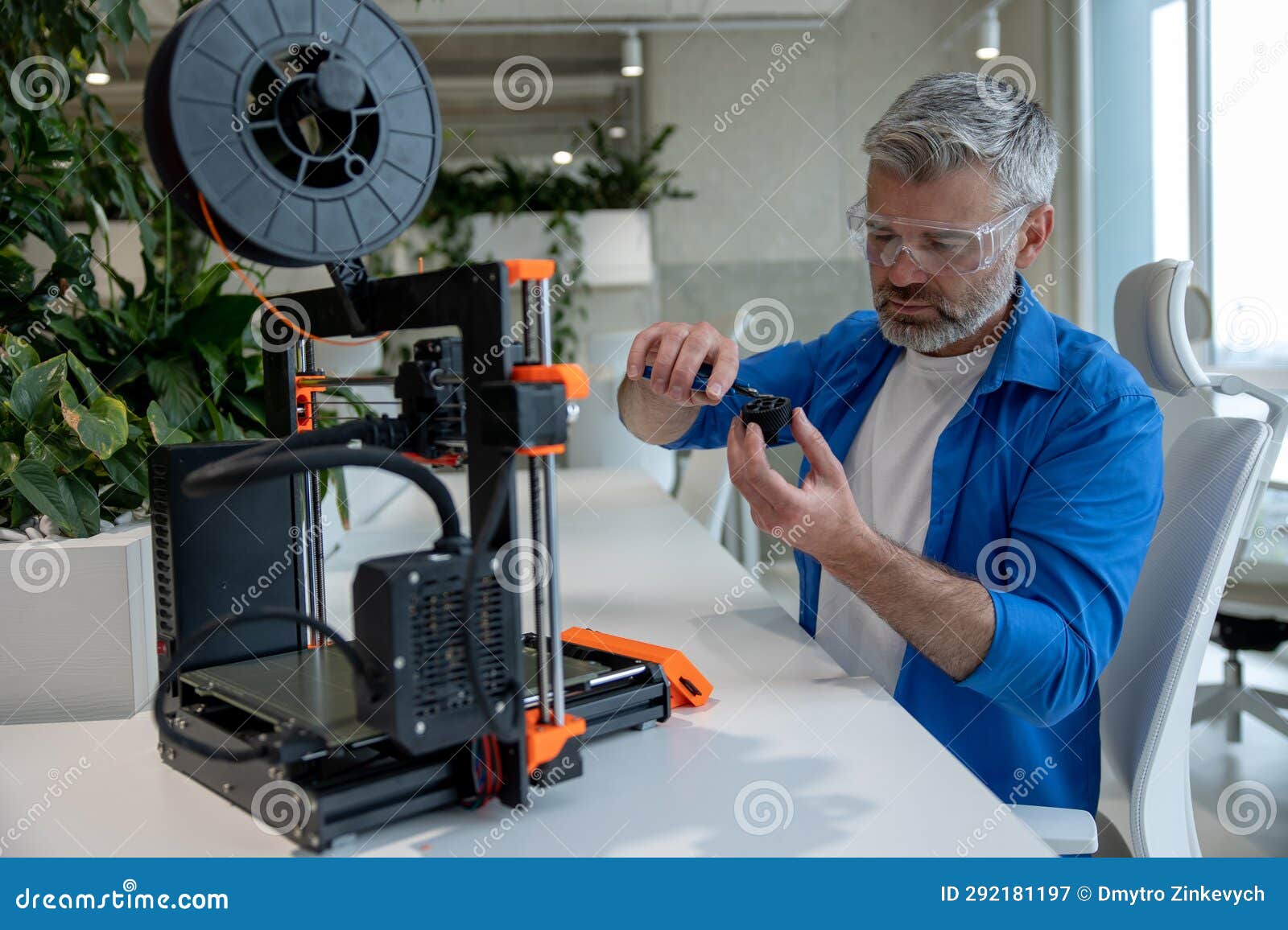 Modern 3D Printer Equipment and Man Working with it in Office. Stock ...