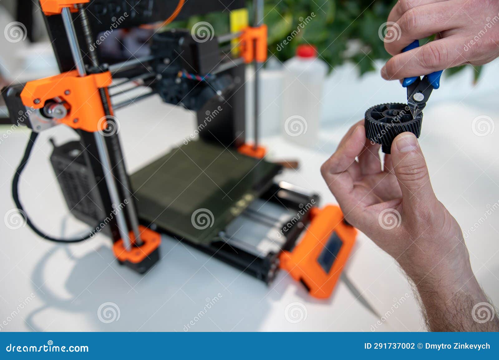 Modern 3D Printer Equipment and Man Working with it in Office. Stock ...