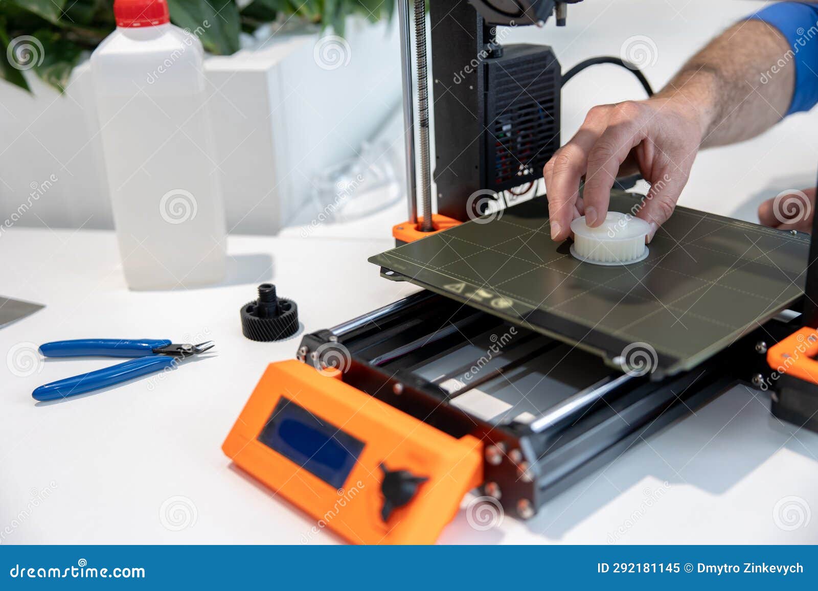 Modern 3D Printer Equipment and Man Working with it in Office. Stock ...