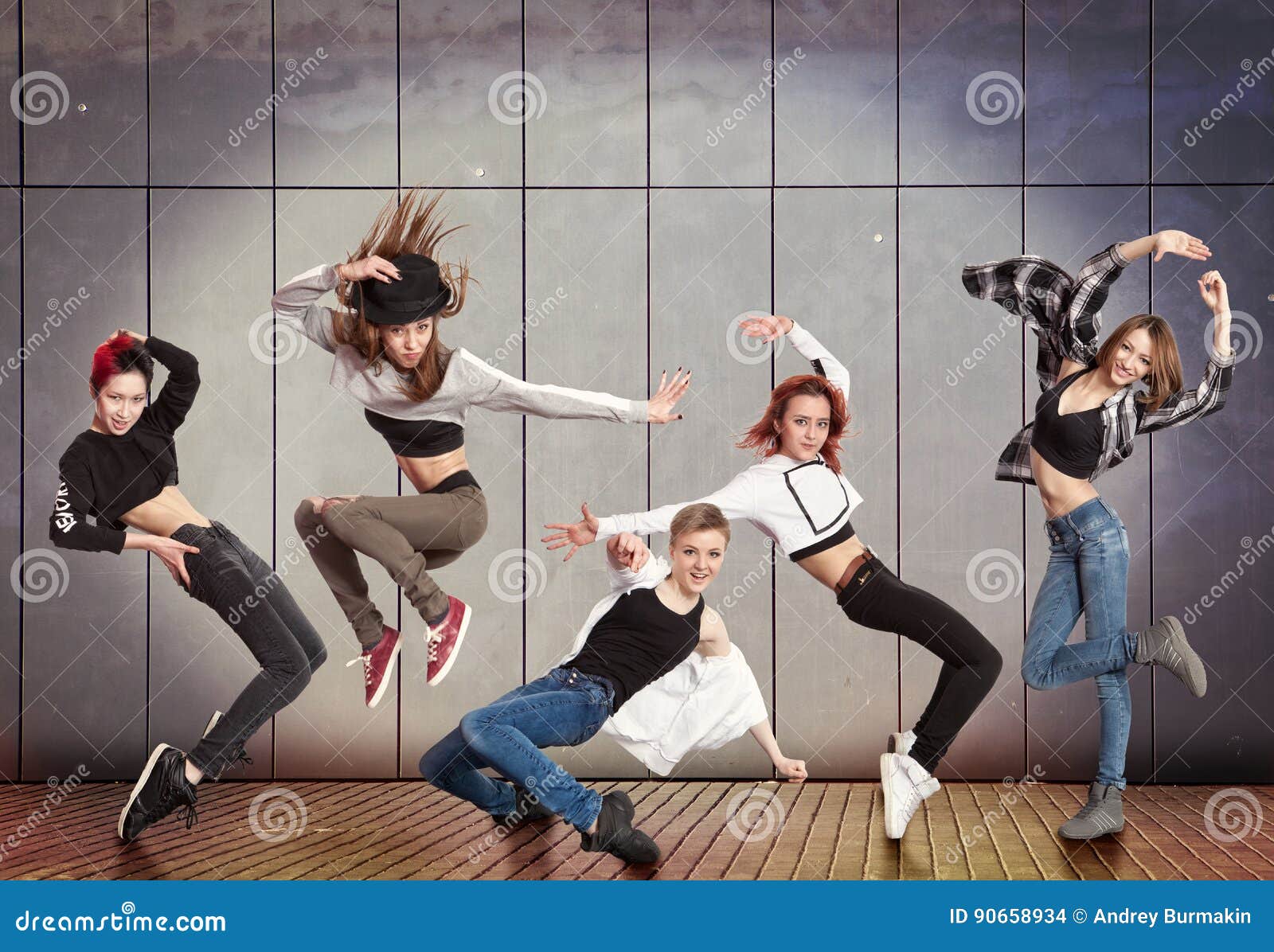 Modern Dancing Group Practice Dancing in Front Wall Stock Photo - Image ...