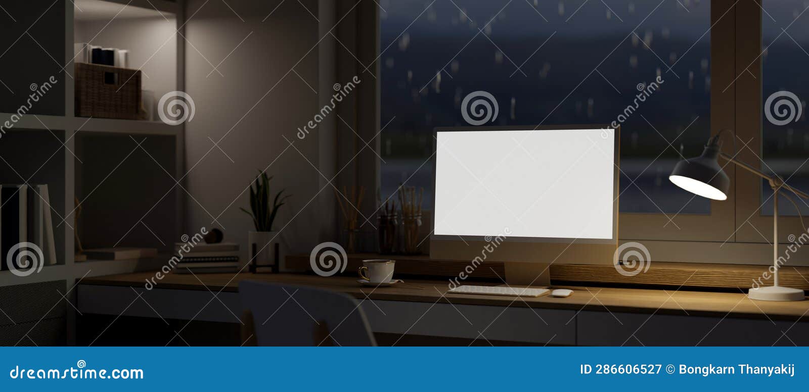 A Modern, Dark Home Workspace with a Computer on a Desk Against the ...